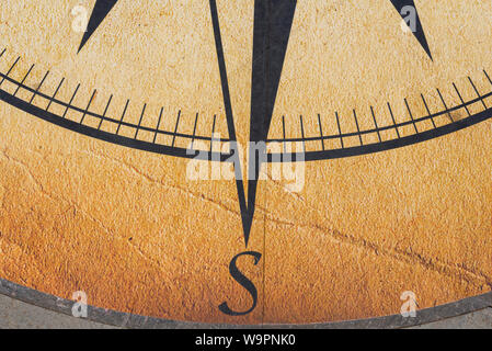 The compass is drawn on a concrete slab. The concept of the earth ...