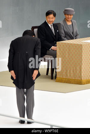 Japan's Emperor Naruhito (back, C) and Empress Masako arrive at the ...
