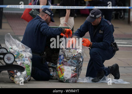 Police officers conduct a search outside the Palace of Holyroodhouse in ...