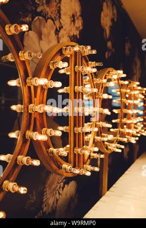 A wall with old dirty mirrors on it and lantern lamps in dust Stock ...