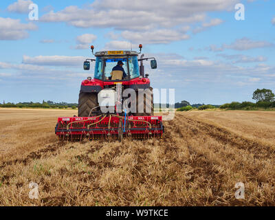 A Massey Ferguson 6490 tractor with a subsoiler and front mounted tank ...