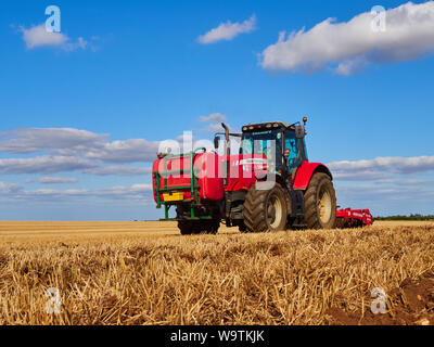 A Massey Ferguson 6490 tractor with a subsoiler and front mounted tank ...