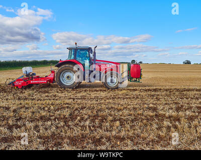 A Massey Ferguson 6490 tractor with a subsoiler and front mounted tank ...