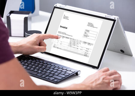 The hands working on accounting calculator calculating profit Stock ...