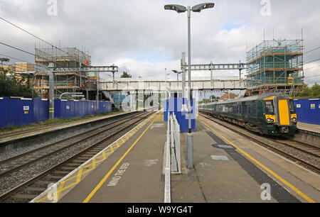 Construction of new pedestrian bridges at an empty Langley railway ...
