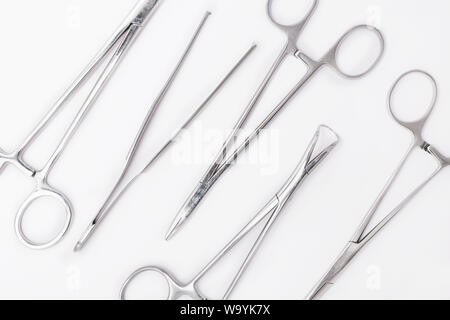 Metal surgical instruments on white background. Flat lay Stock Photo ...