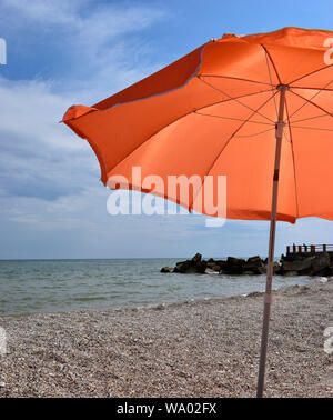 Colorful wet umbrella in the sunlight Stock Photo - Alamy
