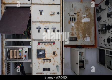 Rusty old electrical circuit breaker box on the exterior of an ...