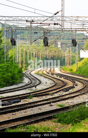 Four lane railroad with double curve tracks Stock Photo - Alamy