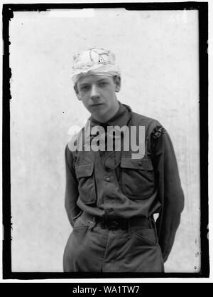 A photograph of a Boy Scouts training demonstration, showing young ...