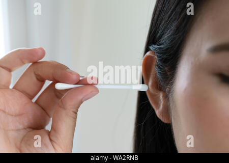 Woman Cleaning Ear Stock Photo - Alamy