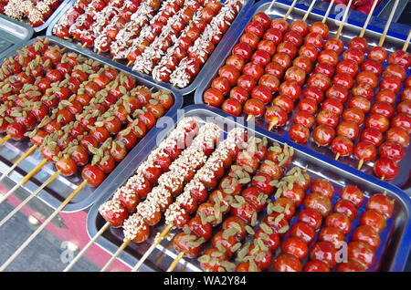 Ice-sugar gourd is a traditional Chinese delicacy Stock Photo - Alamy