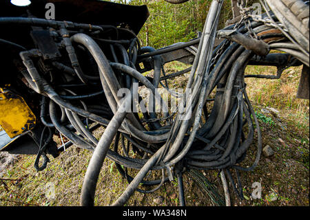 Details of a drilling rig. Hydraulic hoses and cables Stock Photo - Alamy