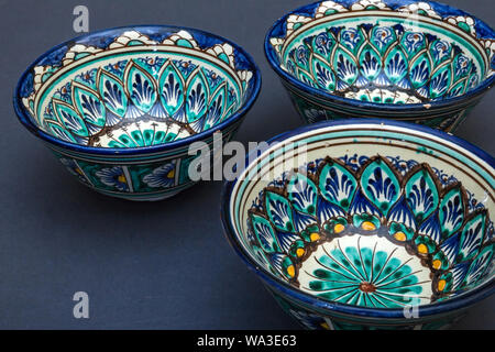 Ethnic Uzbek ceramic tableware on the gray background. Decorative ...