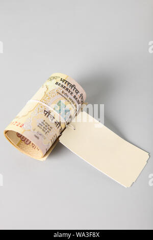Money roll of five hundred rupees note with a tag of bike Stock Photo ...