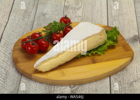 Brie cheese triangle served salad leaves Stock Photo - Alamy