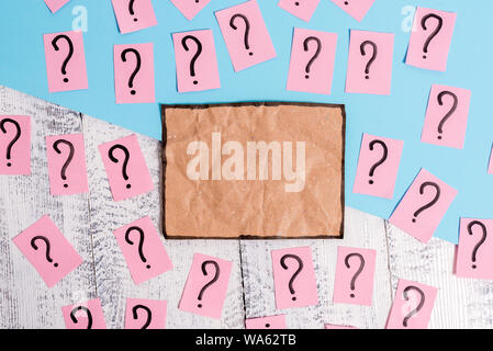 Scribbled and crumbling papers with thick cardboard above wooden table ...