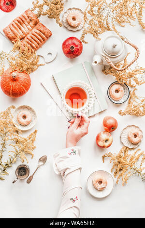 Flat lay. Pumpkin mug cake garnished with homemade whipped cream and ...