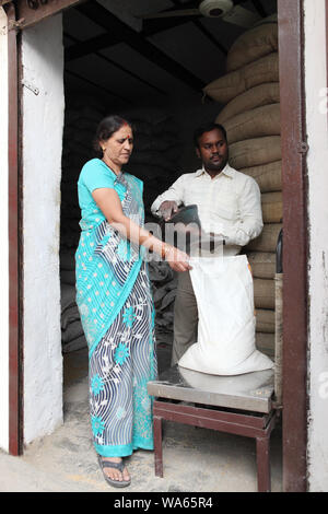 Poor people getting food at low cost from government rashan shop Stock ...