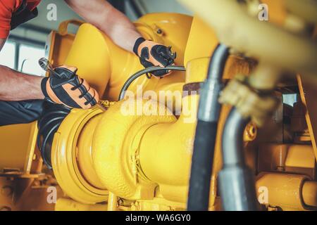 Bulldozer Professional Mechanic. Caucasian Technician Taking Machine ...