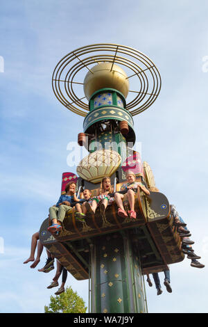 Fairground children; kids having fun on a fairground ride; Tivoli ...