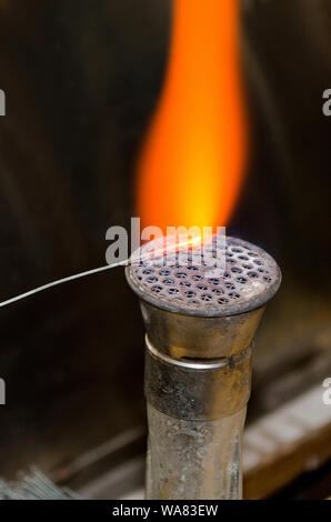 Bunsen Burner flame test in the science laboratory. Flaming a tube in ...