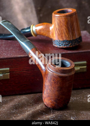 Captain smoking pipe with tobacco Stock Photo - Alamy