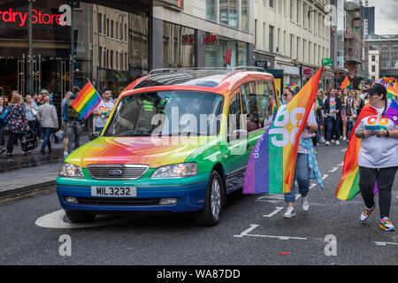 A Co-Op Funeralcare hearse in gay rainbow colours at Pride Glasgow 2019 ...