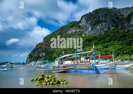 Bangkas moored on Corong Corong Beach at sunset, El Nido, Bacuit Bay ...