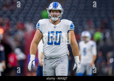 Detroit Lions center Graham Glasgow (60), guard Kayode Awosika (74 ...