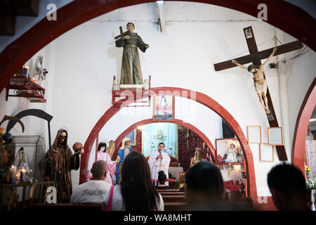 Mexican followers of Santa Muerte (Saint Death) gather to attend a mass ...