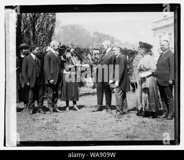 A photograph of President Warren G. Harding standing on the White House ...