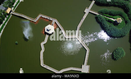 Aerial view of a highway around the Bosten Lake, one of the largest ...