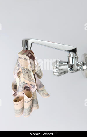 Indian fifty rupee notes Pouring Out of Water Tap Stock Photo - Alamy