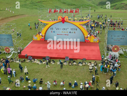 Chinese people of the Yi ethnic group daub their faces black to ...