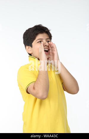 Child shouting hands cupped to mouth Stock Photo - Alamy