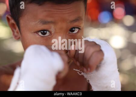 Tattoo Lethwei boxer at a rural tournament in a village near Hpa An ...