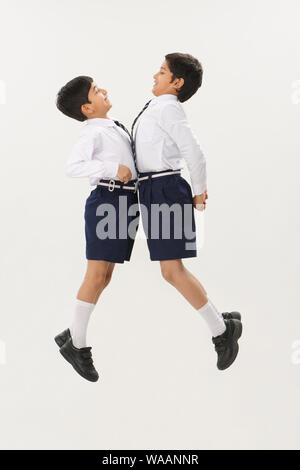 Two boys hitting chests together Stock Photo - Alamy