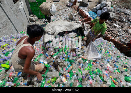 Dhaka, Bangladesh - August 19, 2019: A Bangladeshi worker collects ...