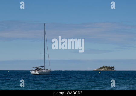 Yacht moving in sea near small island, Rovinj, Istria, Croatia Stock ...
