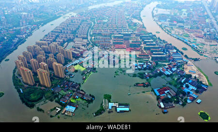 Aerial view of buidings overwhelmed by flood caused by heavy rain in ...