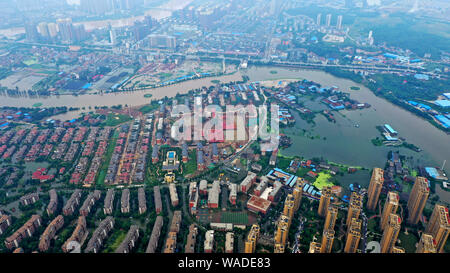 Aerial view of buidings overwhelmed by flood caused by heavy rain in ...