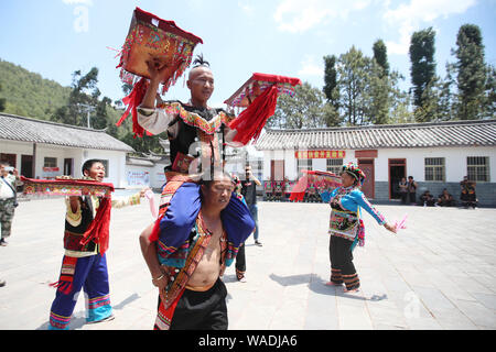 Yi People sing and dance during intangible cultural heritage ...
