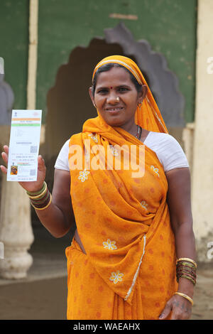 Rural woman showing an Aadhar card Stock Photo - Alamy