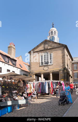 People shopping in Whitby market place and the Old Town Hall, North ...