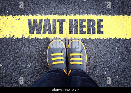 wait behind the yellow line Stock Photo: 37686894 - Alamy