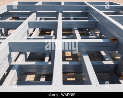 Stacked metal frame of a pre-fabricated building. Fast-built camp ...