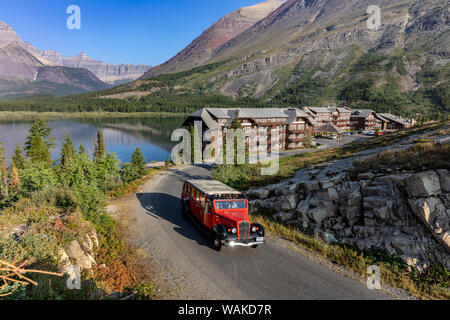 Red Jammer bus departing the Many Glacier Hotel in Glacier National ...