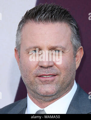 WESTWOOD, CA - AUGUST 20: Director Ric Roman Waugh (R) and wife Tanya ...