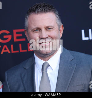WESTWOOD, CA - AUGUST 20: Director Ric Roman Waugh (R) and wife Tanya ...